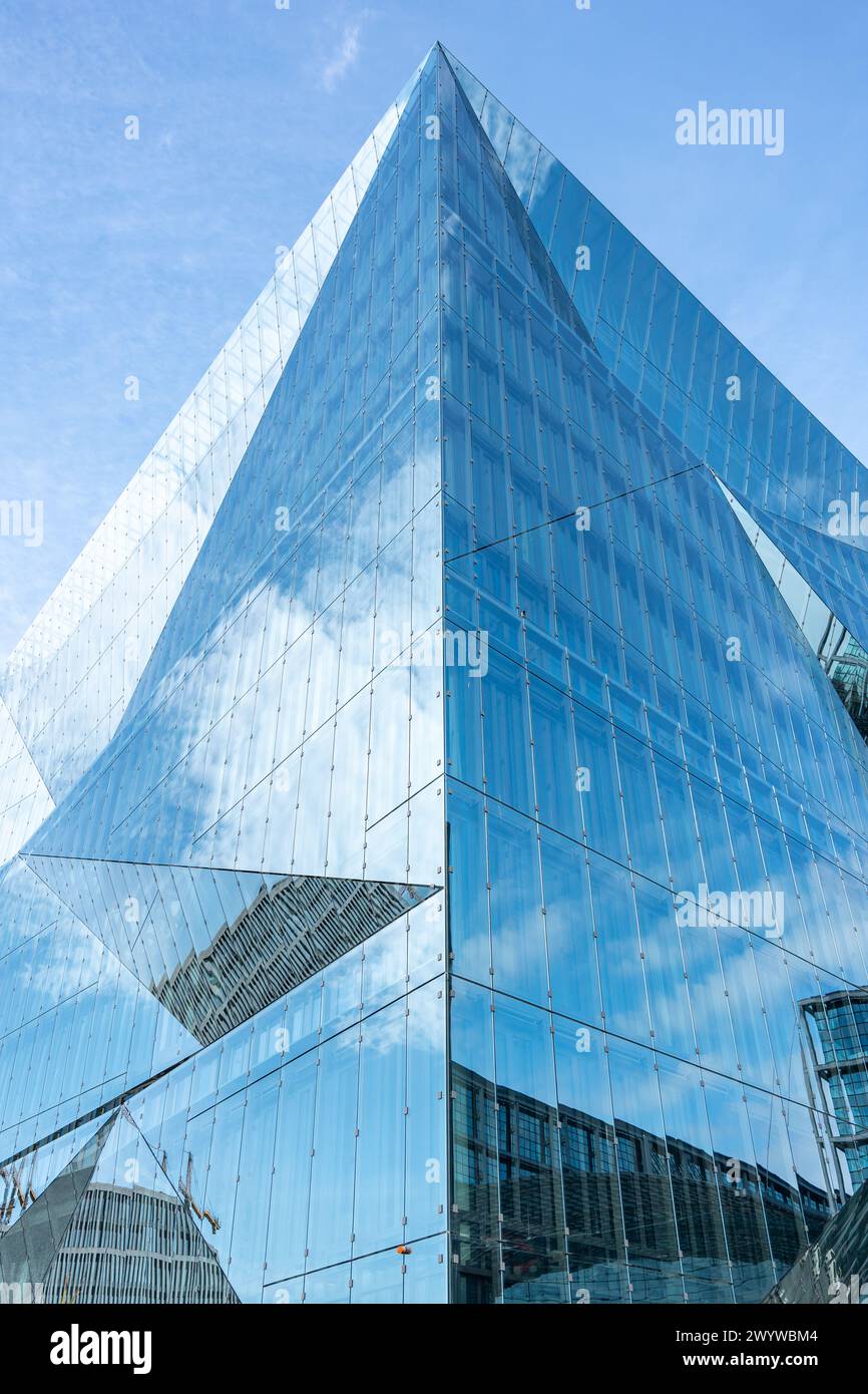 Glass building against the blue sky. Glass building facade close-up ...