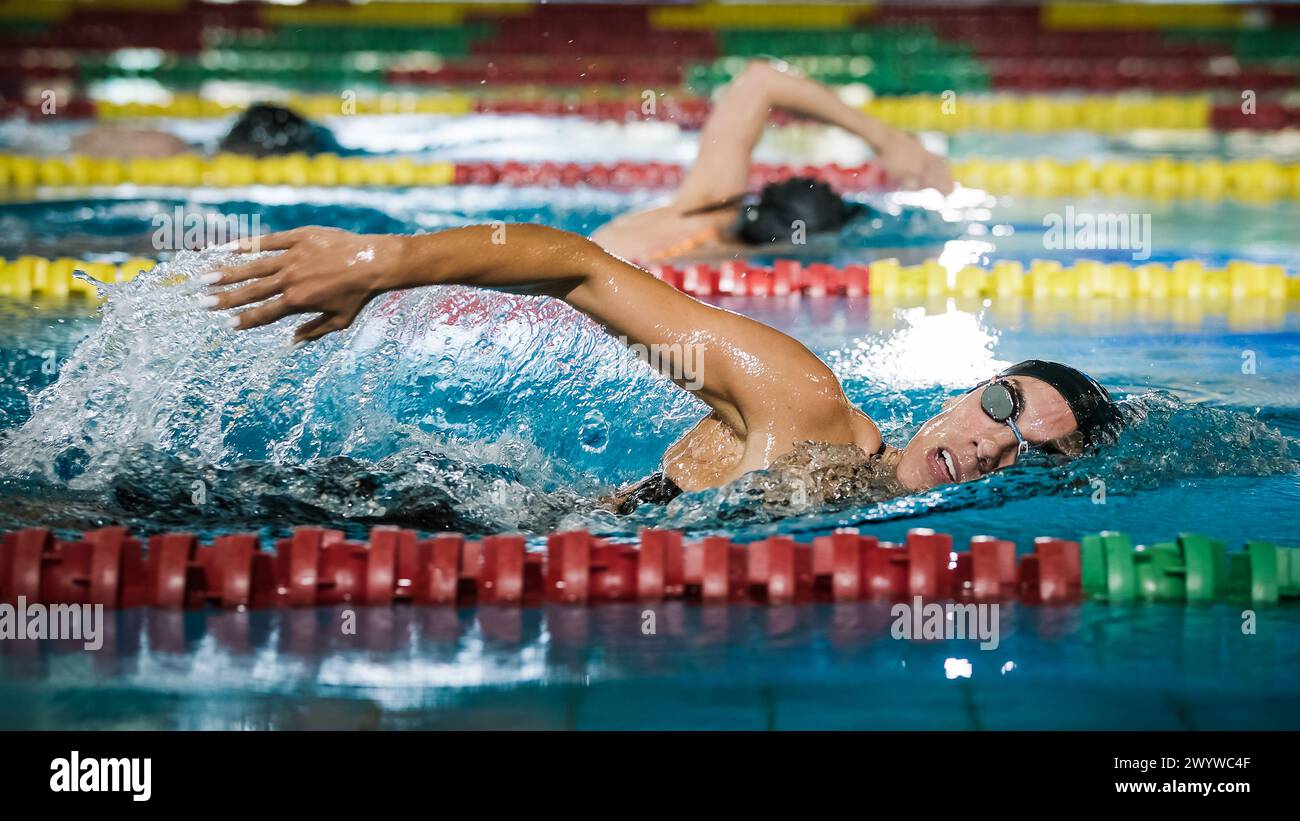 Two female swimmers during a race in the freestyle swim discipline ...