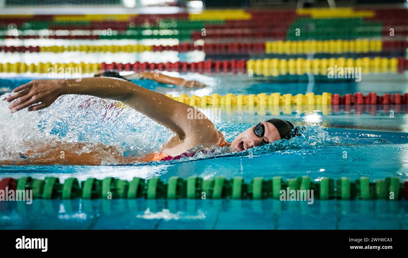 Professional sportswoman, a swimmer during freestyle swimming training ...
