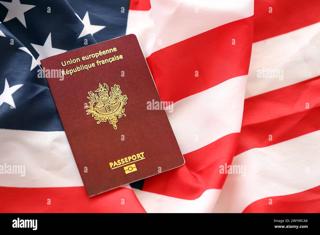 French passport on United States national flag background close up ...