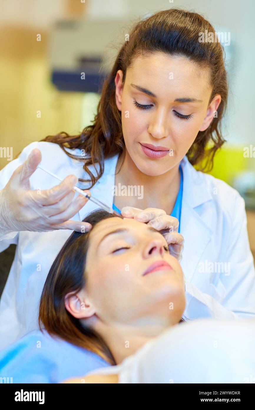 Syringe. Botox, cosmetic medicine. Botulinum toxin treatment involves ...