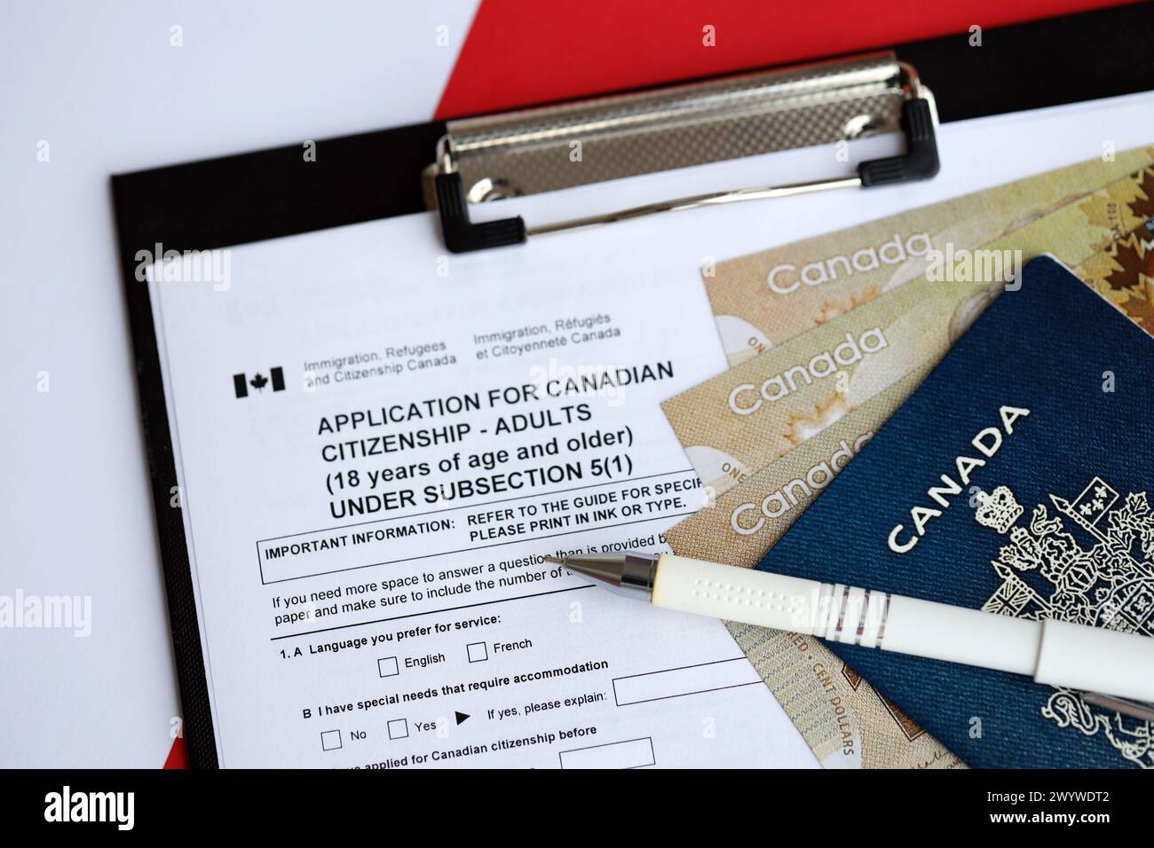 Application for Canadian citizenship for adults on table with pen ...