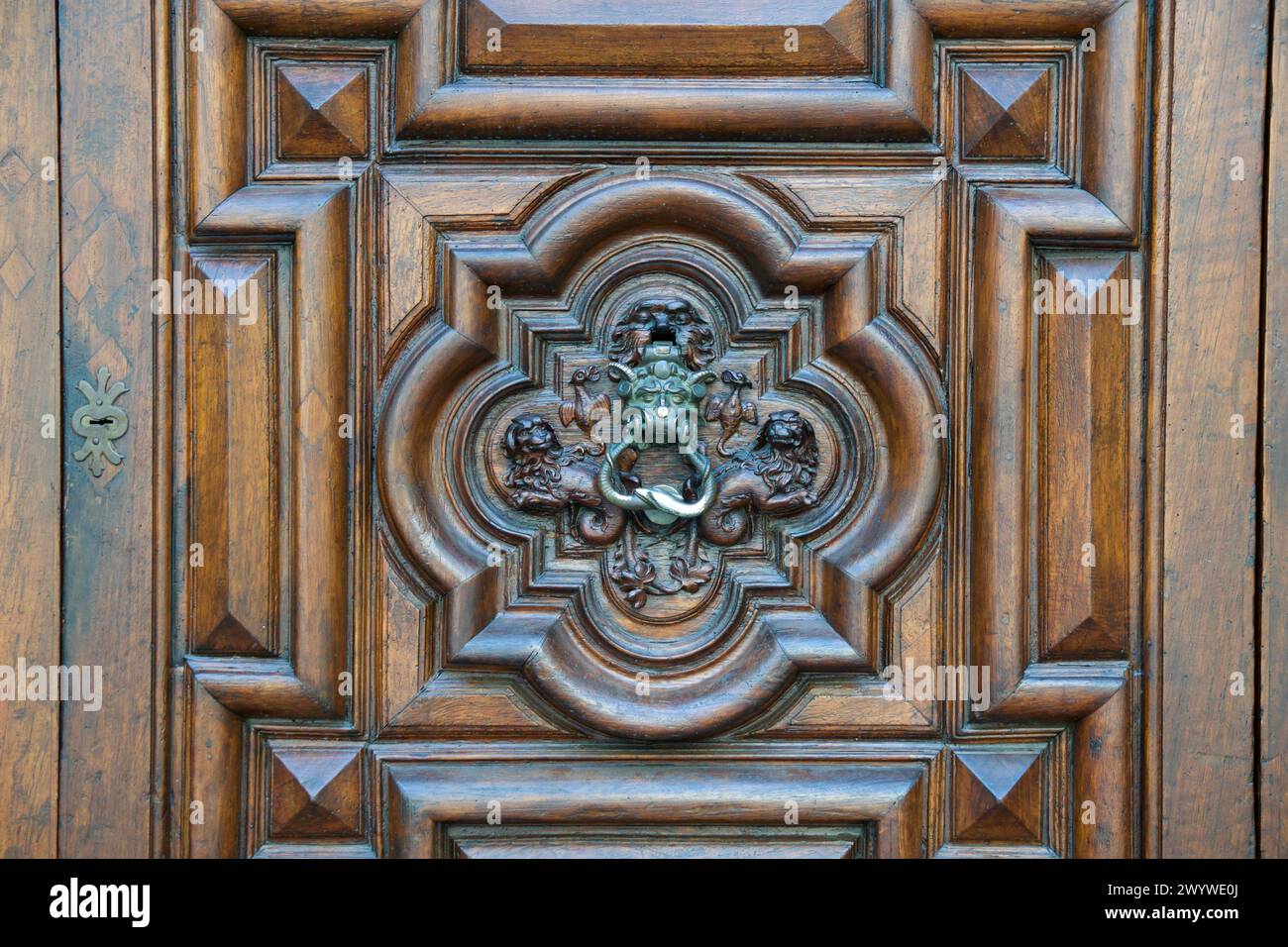 TURIN, ITALY - SEP 14, 2019: Beautiful handmade heavy wooden door, the ...