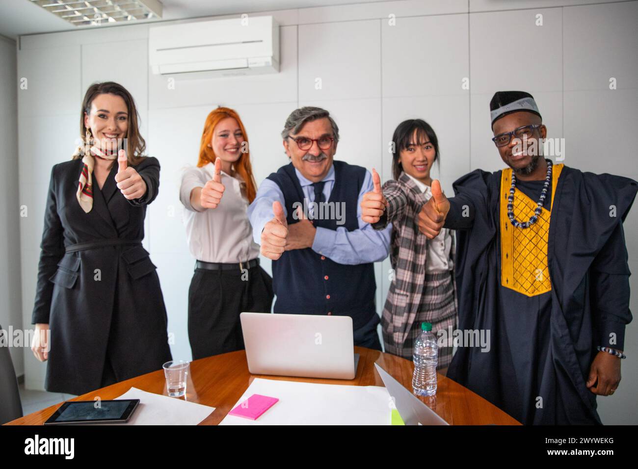 Group of business people show thumb up, positivity during meeting Stock ...