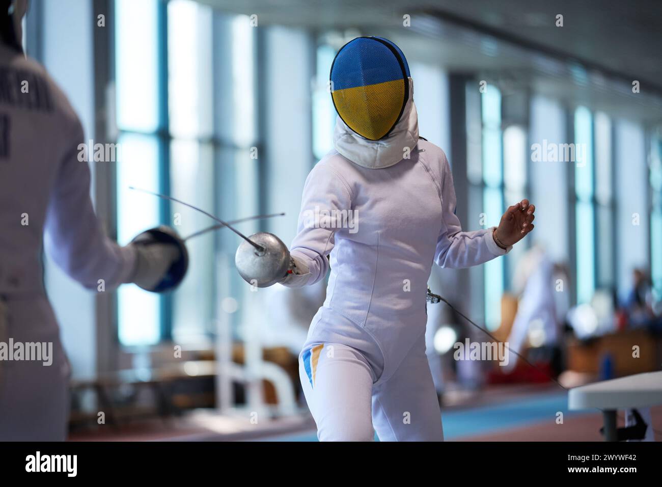 National Fencing Team Member in a protective mask painted in colors of ...