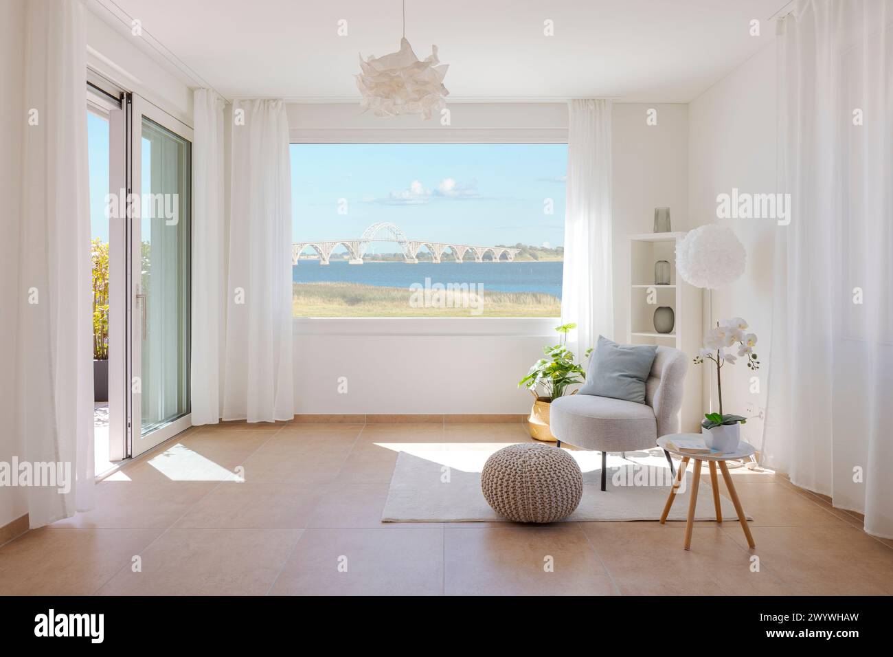 Front view of a living room corner with a small armchair and a coffee ...