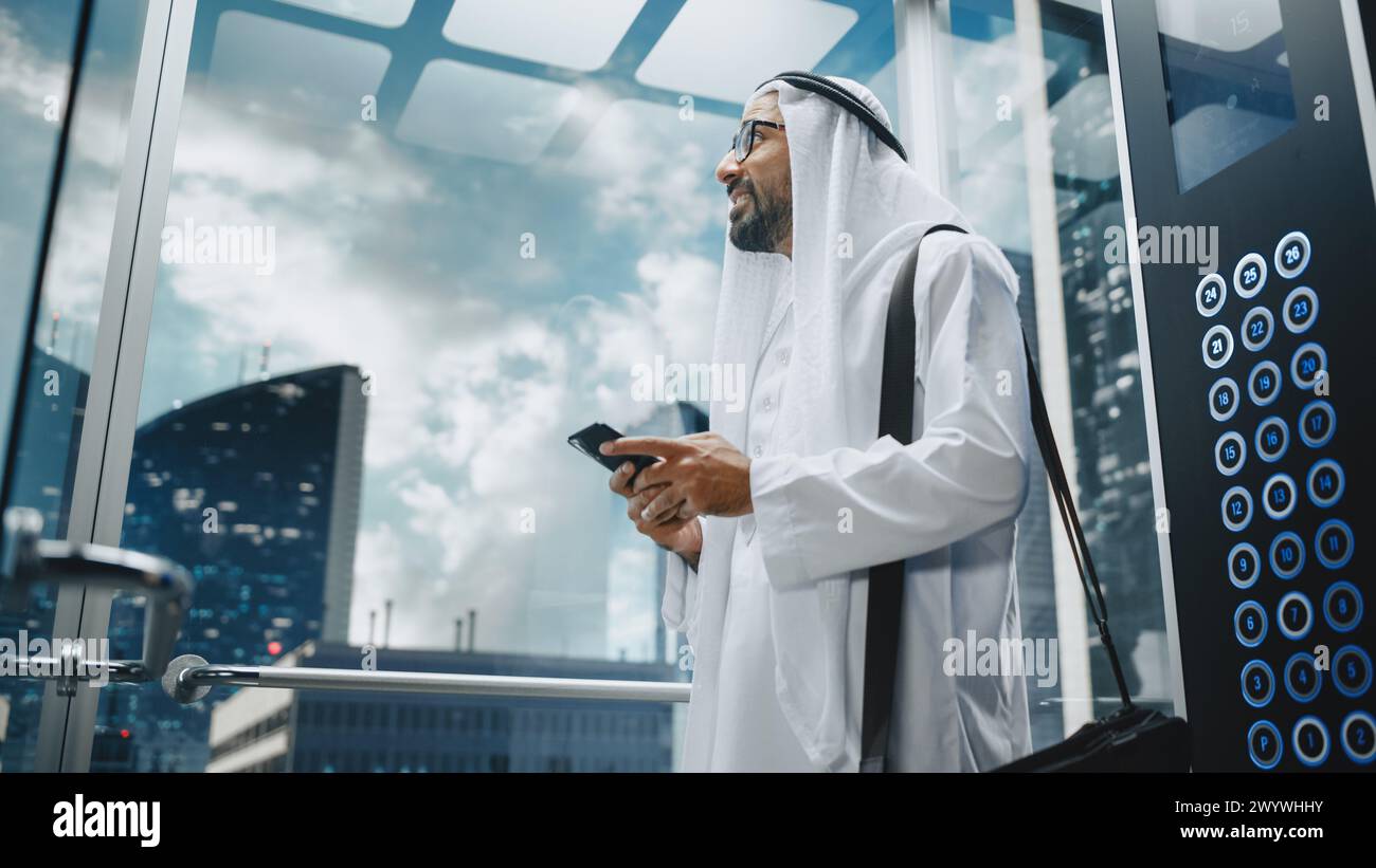 Successful Muslim Businessman in Traditional White Kandura Riding Glass ...