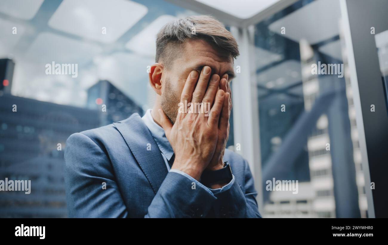 Stressed Out Manager Going Down from Office in a Glass Elevator in ...