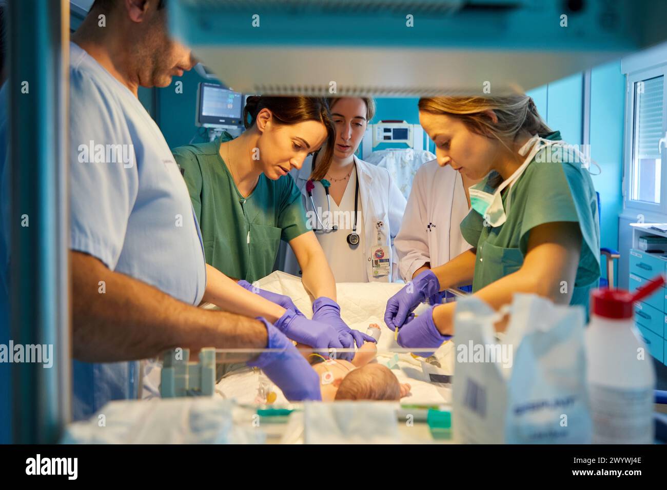 Team of doctors and nurses attending to a baby, Neonatal pediatrics ...