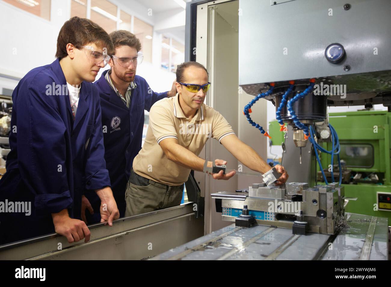Teacher and students do their training center 3-axis machining, Applied ...