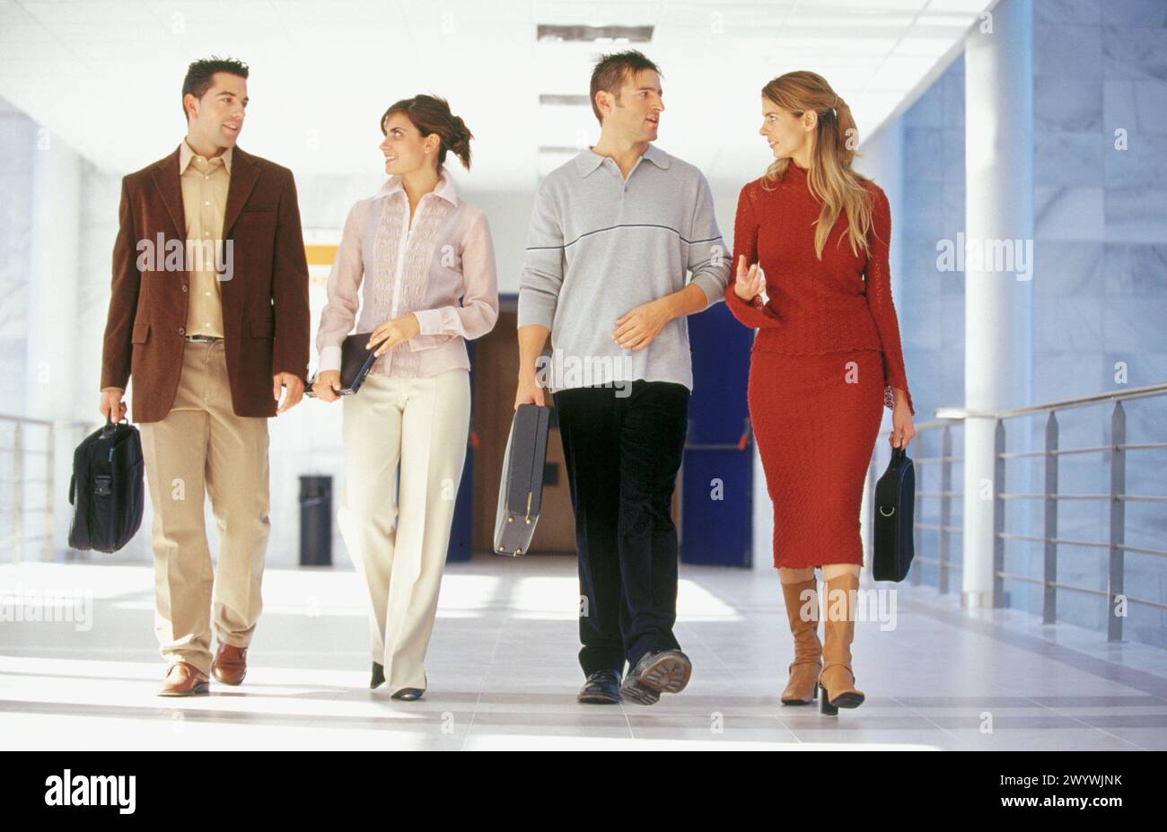 Business partners walking corporate corridor hi-res stock photography ...