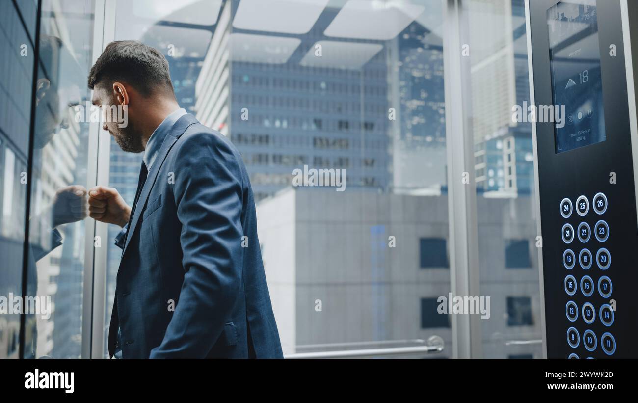Stressed Out Manager Going Down from Office in a Glass Elevator in ...