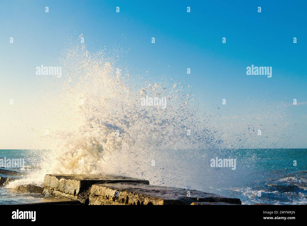 Waves crash on the pier. Water splashes, drops, splash. Marine ...