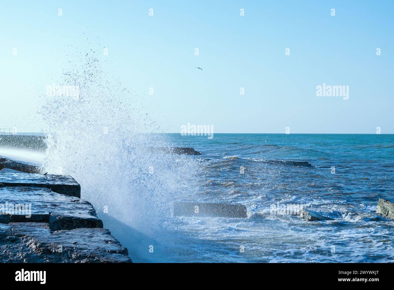Waves crash on the pier. Water splashes, drops, splash. Marine ...
