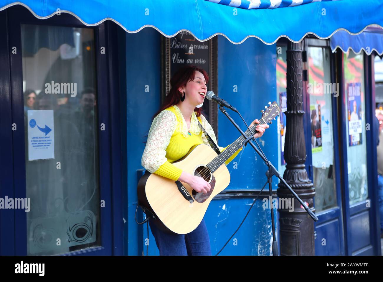 Paris, France -March 31, 2024: Bright performance of street musician in ...