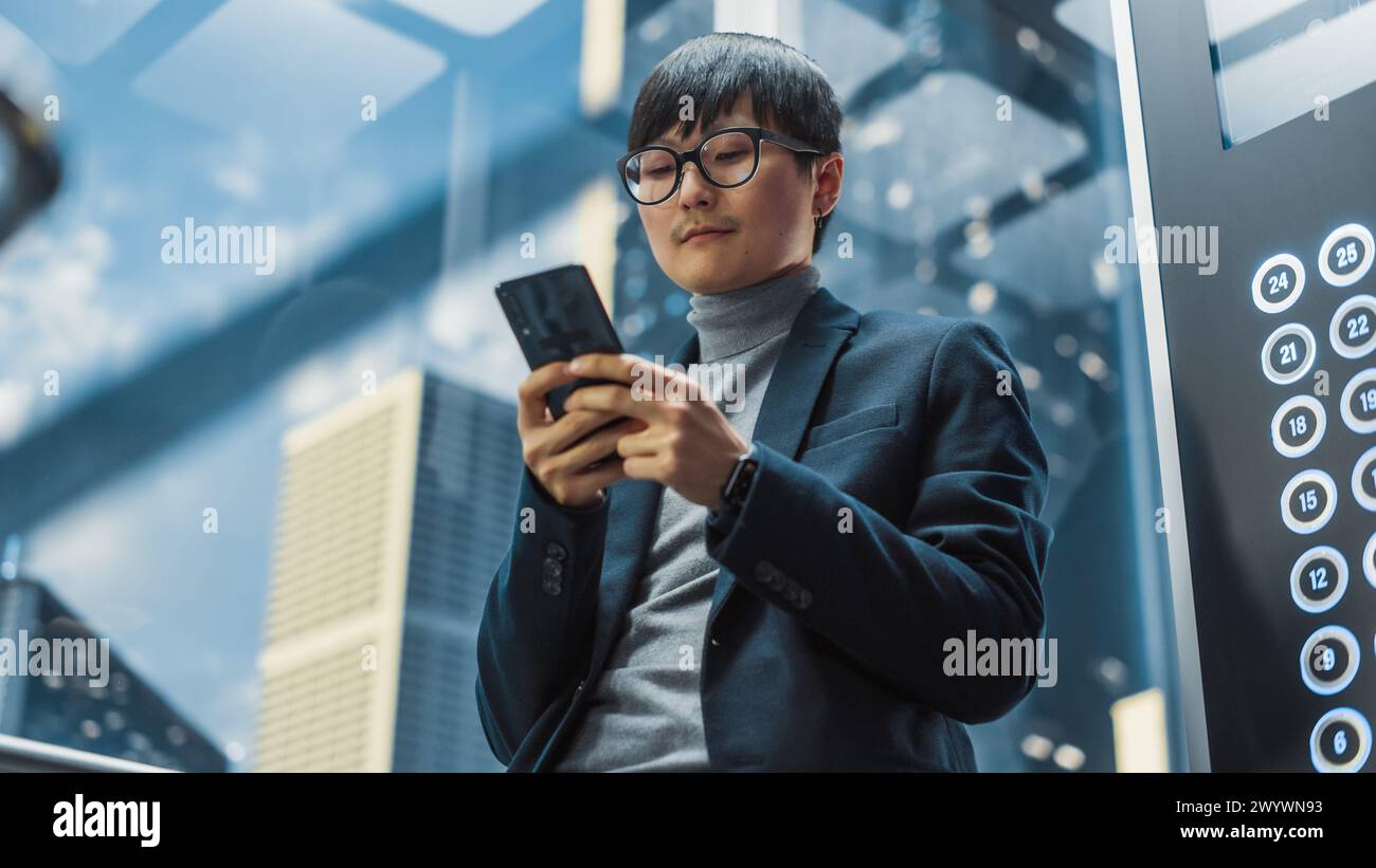 Japanese businessman riding elevator using hi-res stock photography and ...