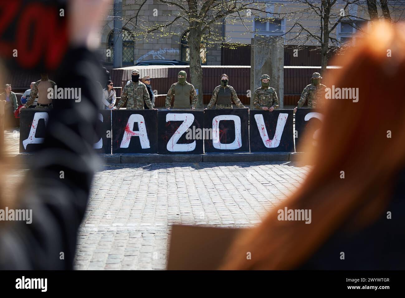 Ukrainian soldiers hold banner "Where Is Azov?" on a public action ...