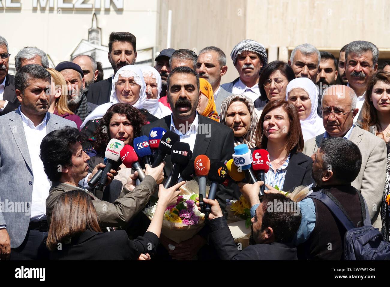 DEM Party members Ayse Serra Bucak Kucuk (R2) and Dogan Hatun (in black ...