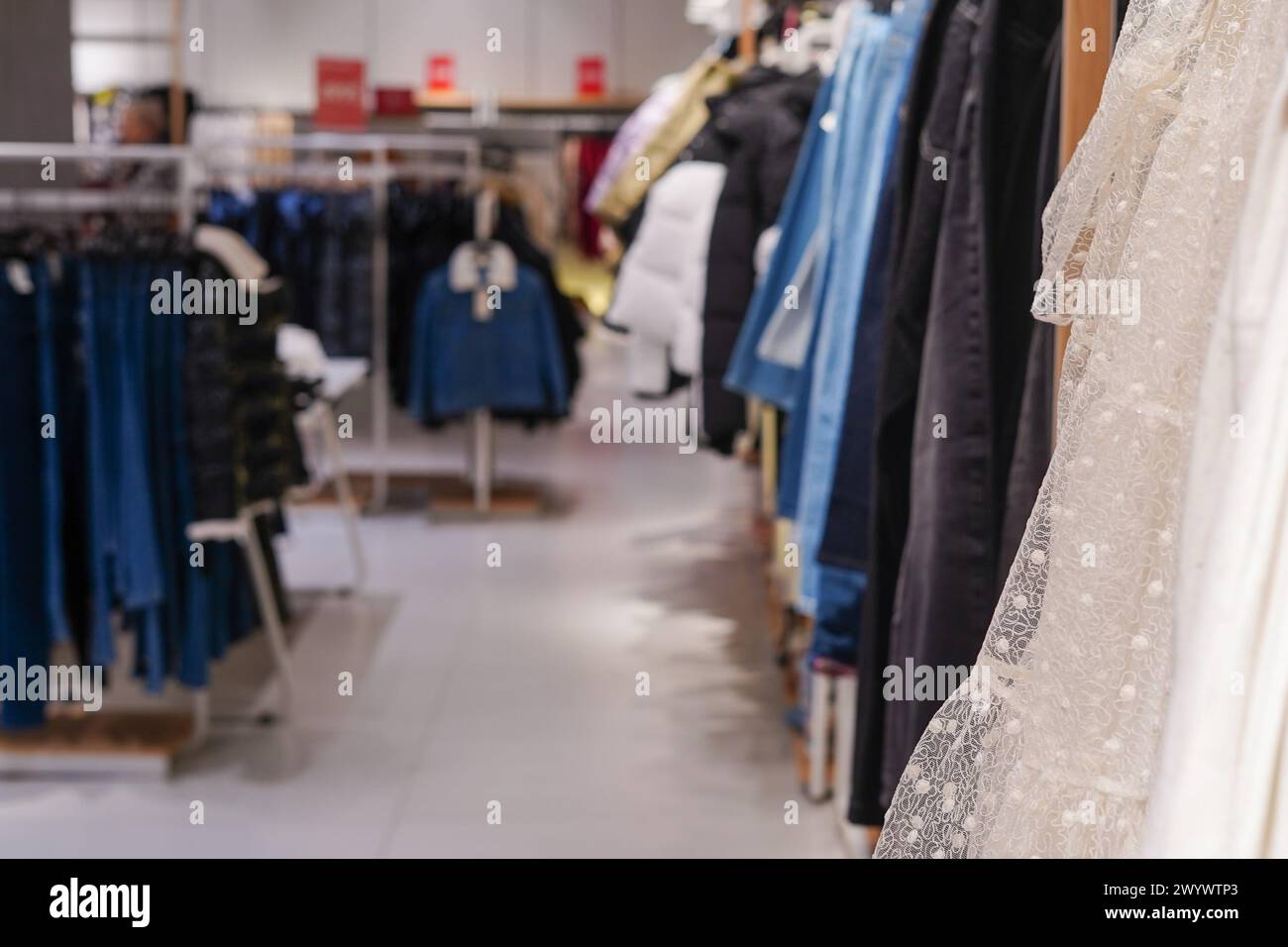 Shopping girls clothes in clothing hi-res stock photography and images ...