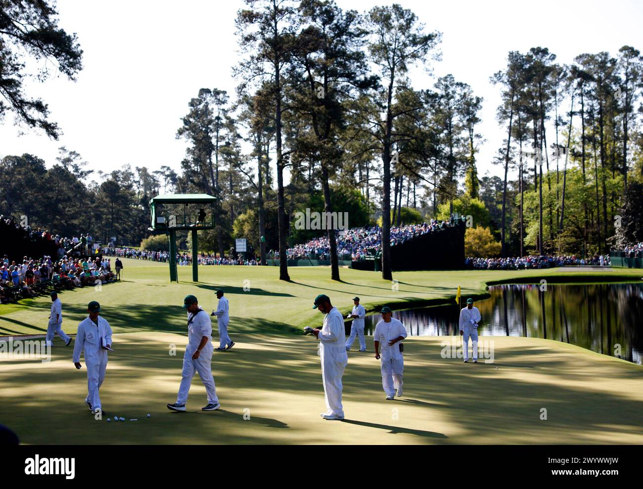 Augusta, United States. 08th Apr, 2024. Caddies roll golf balls to ...