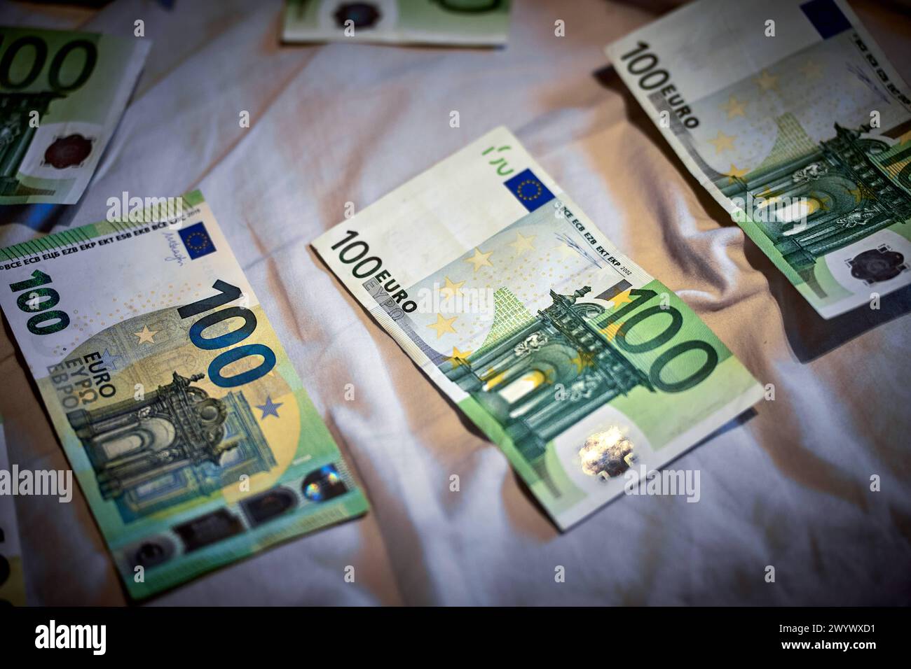 31 March 2024: Symbolic image of counterfeit money, euro cash banknotes ...