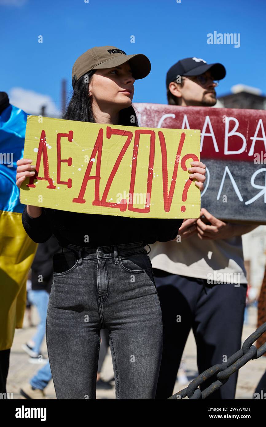 Ukrainian activists hold signs "Where Is Azov?" and "Glory. Freedom" on ...