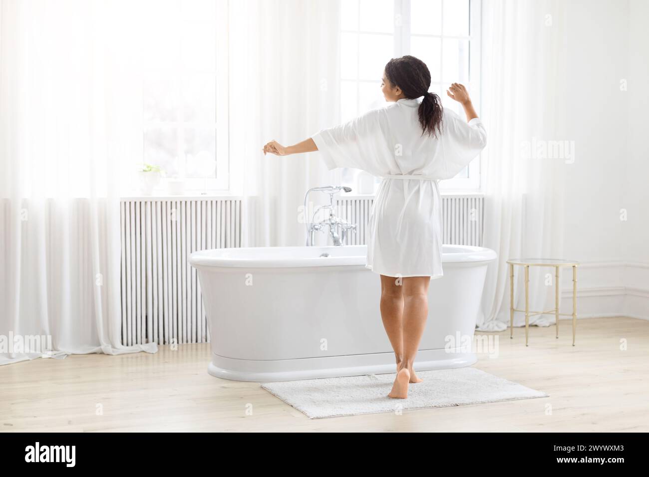Peaceful moment lady enjoying a luxurious bath Stock Photo - Alamy