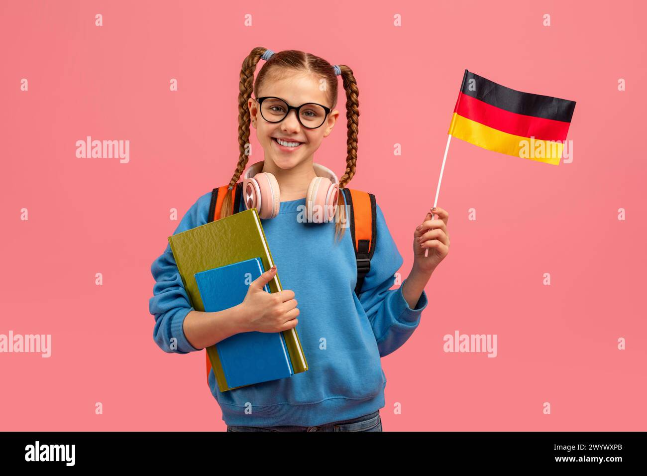 Girl backpack books standing hi-res stock photography and images - Alamy