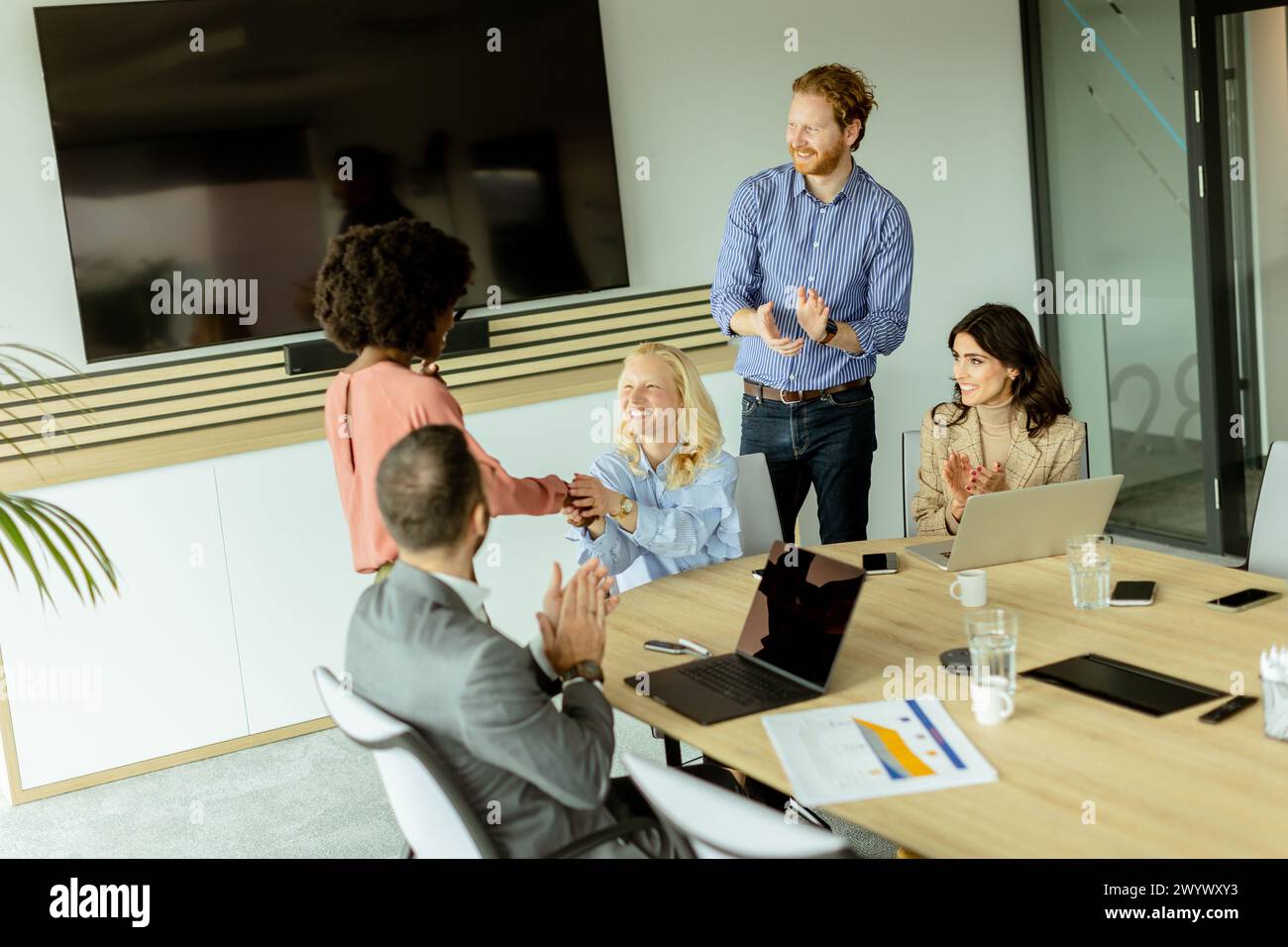 Multiethnic group of professionals brainstorming around a conference ...