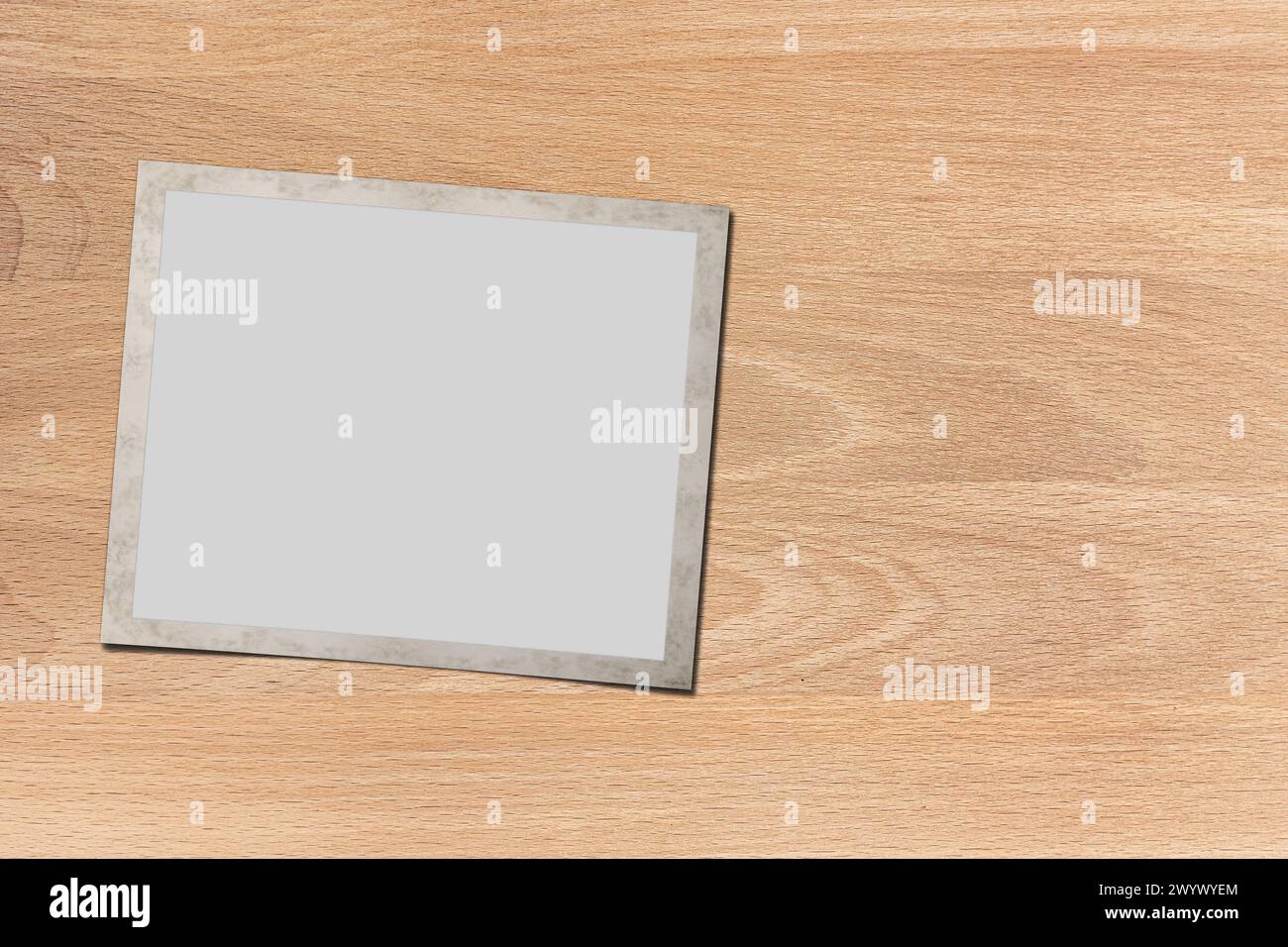 the polaroid card on the wood table Stock Photo - Alamy