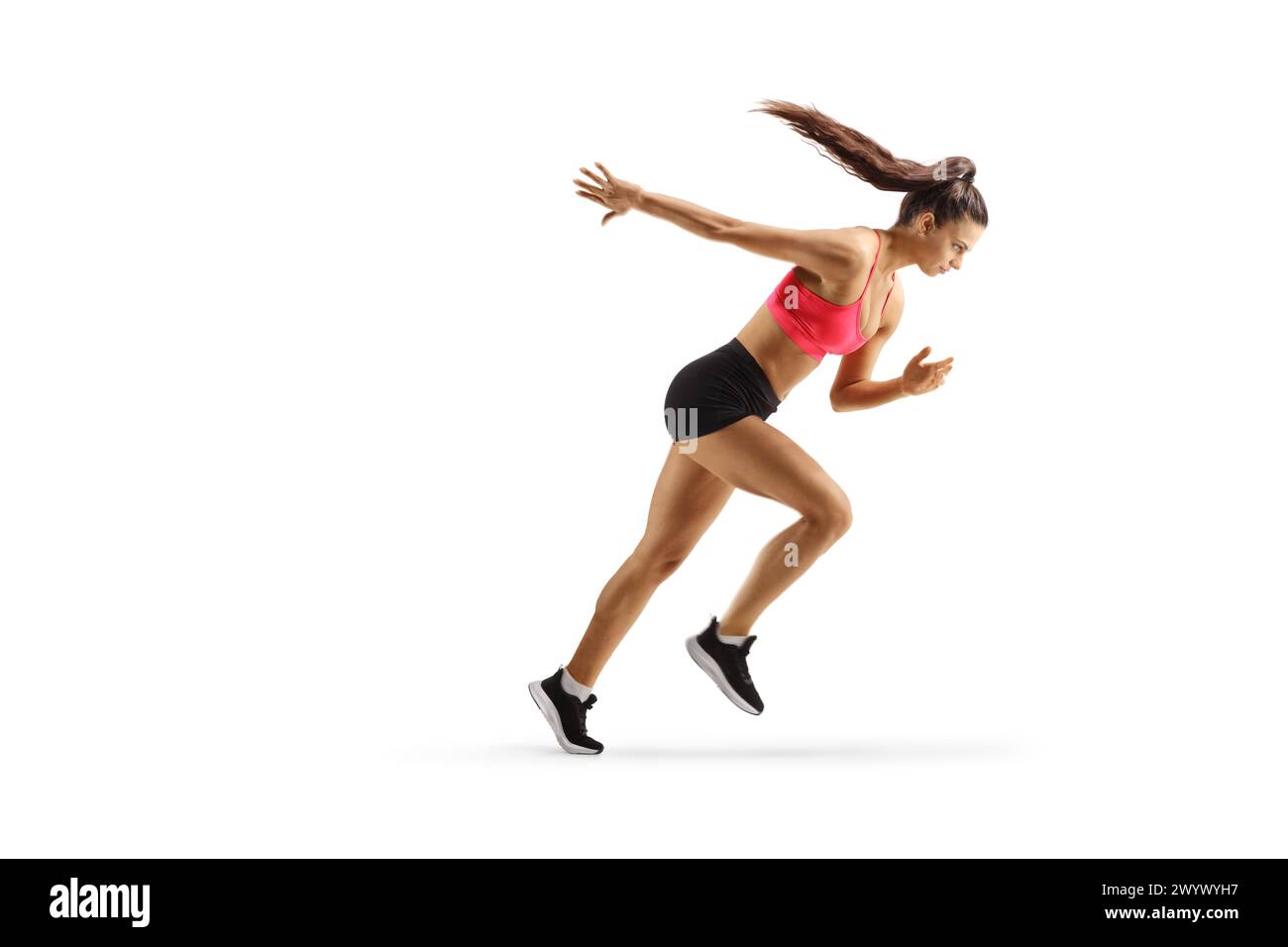 Full length profile shot of a beautiful female athlete running isolated ...