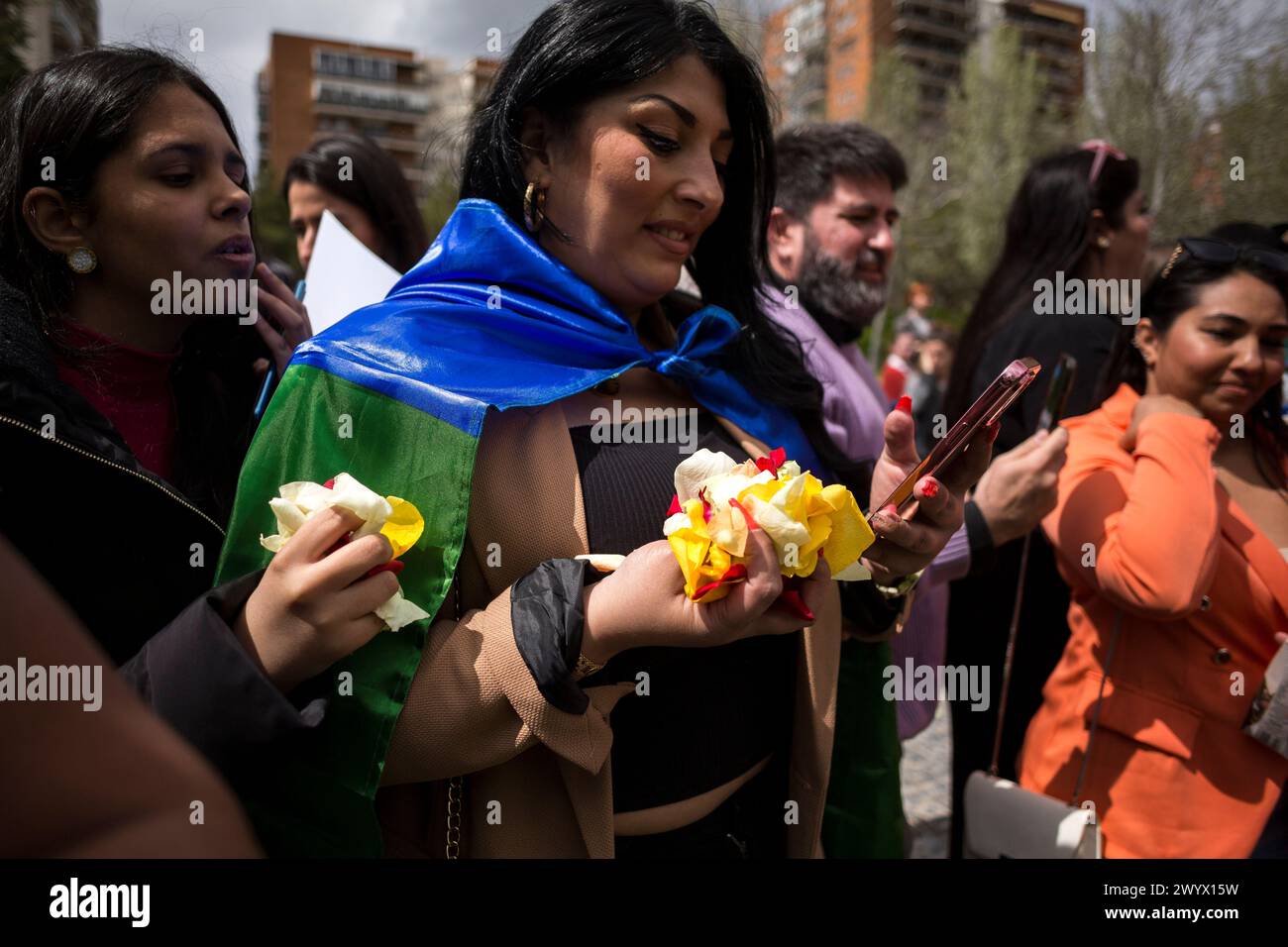 Madrid, Spain. 08th Apr, 2024. A woman holds rose petals in her hands ...