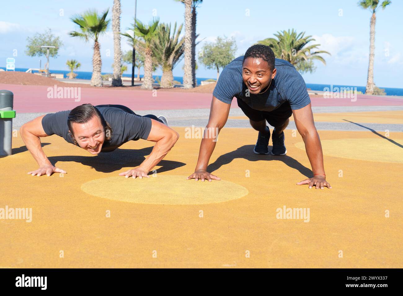 Sport workout of caoucasian and african american men Stock Photo - Alamy