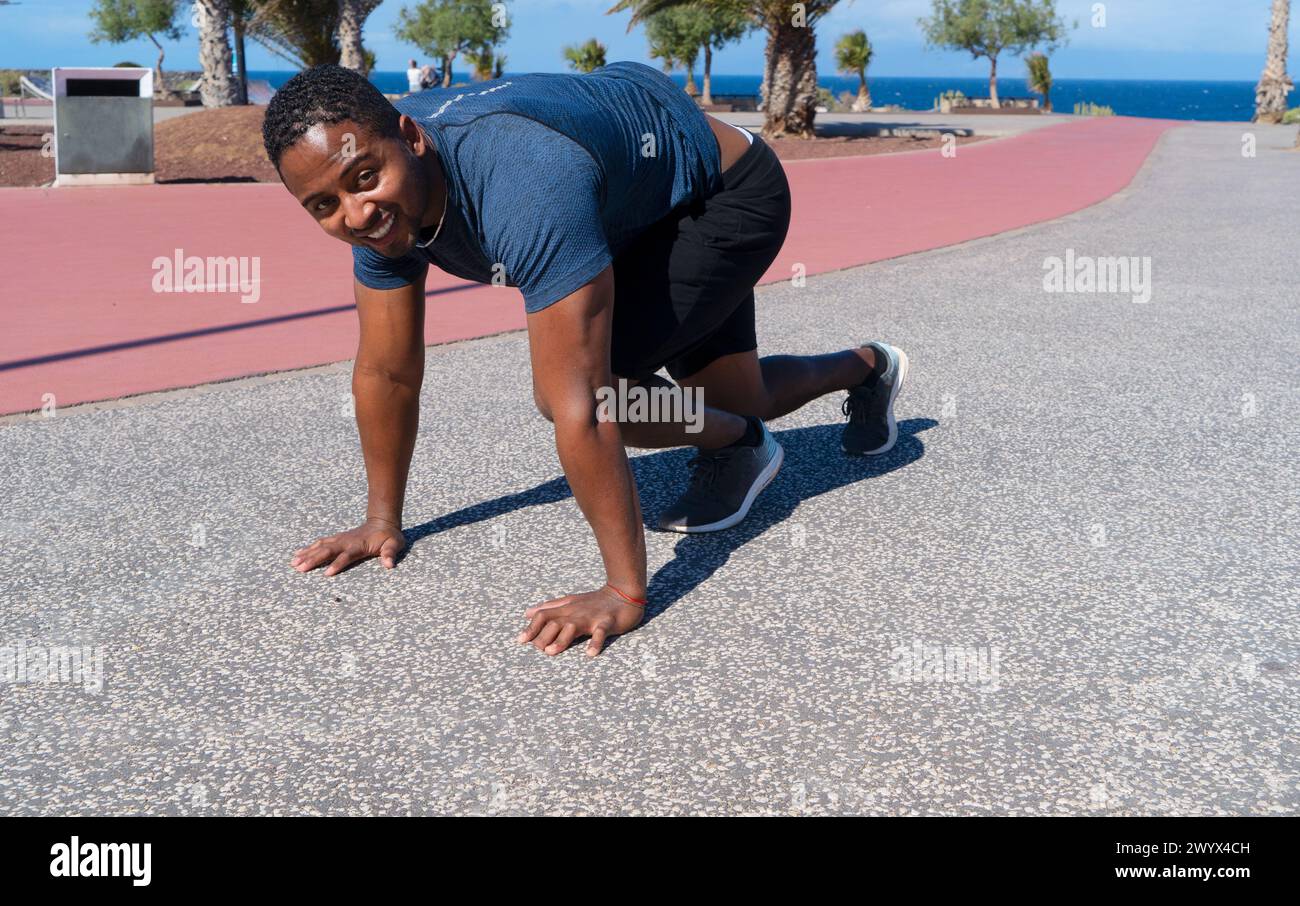 Young athletic man running palm hi-res stock photography and images - Alamy