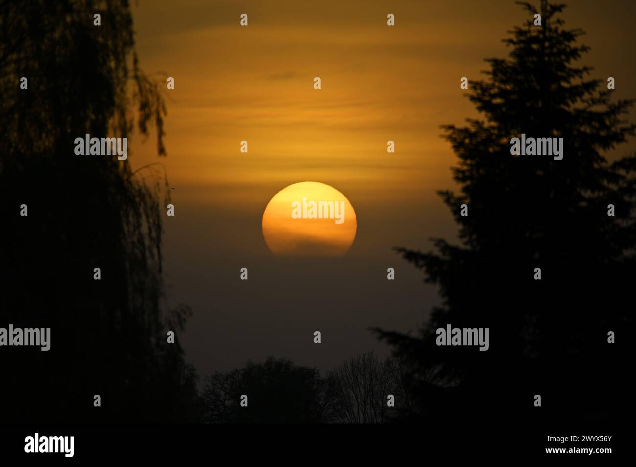 Setting Sun With Clouds In Hamburg, Germany Stock Photo - Alamy