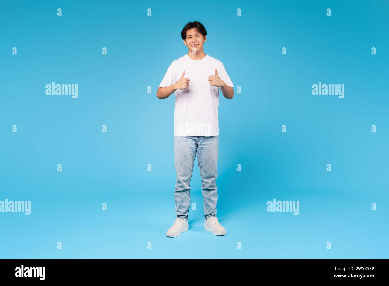 Full body shot of a cheerful young guy Stock Photo - Alamy