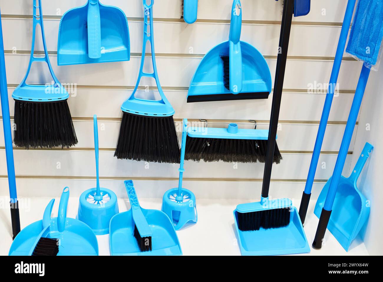Plastic brushes and scoops for cleaning in the store Stock Photo - Alamy
