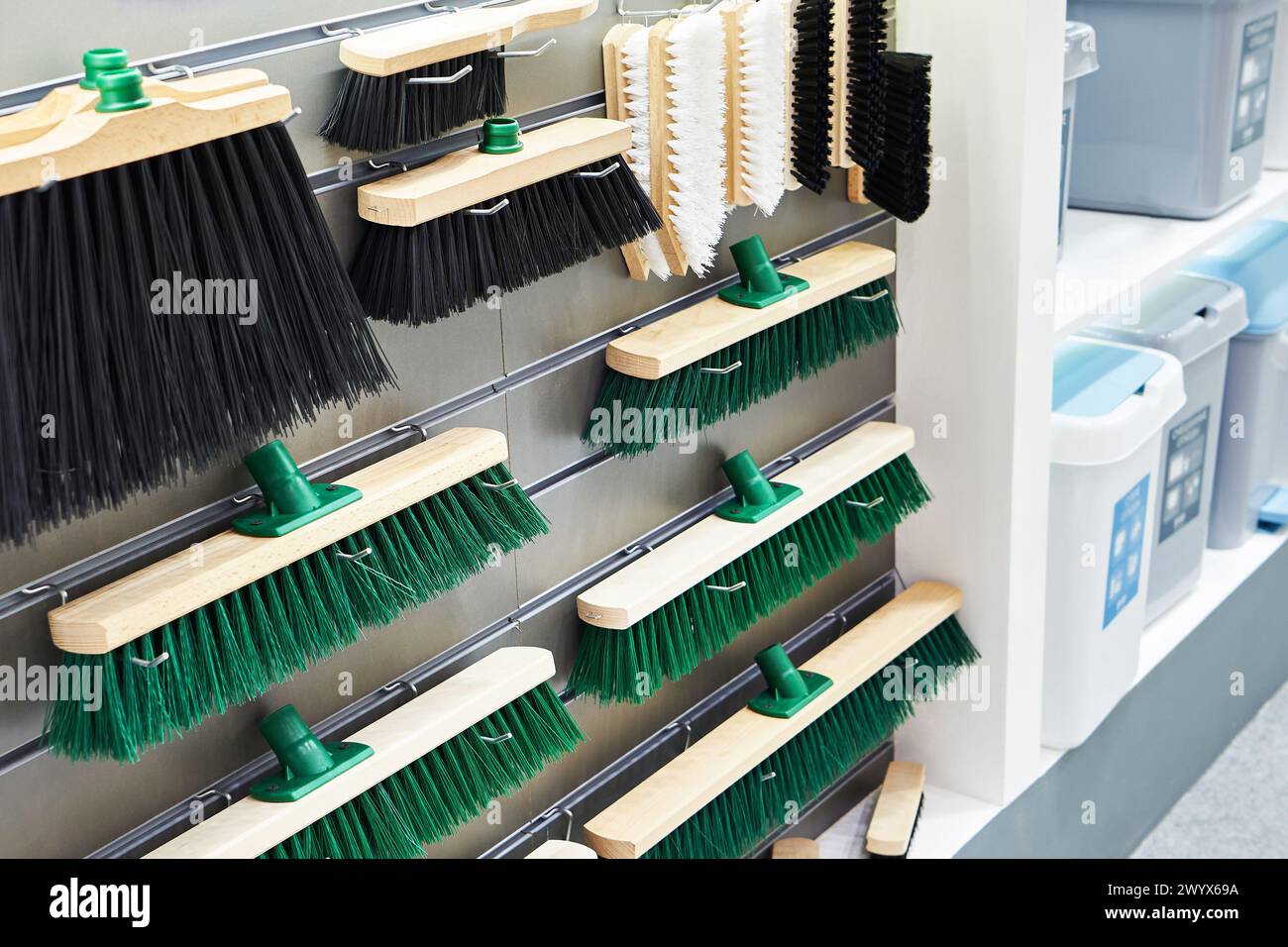 Brushes and brooms in the household goods store Stock Photo - Alamy