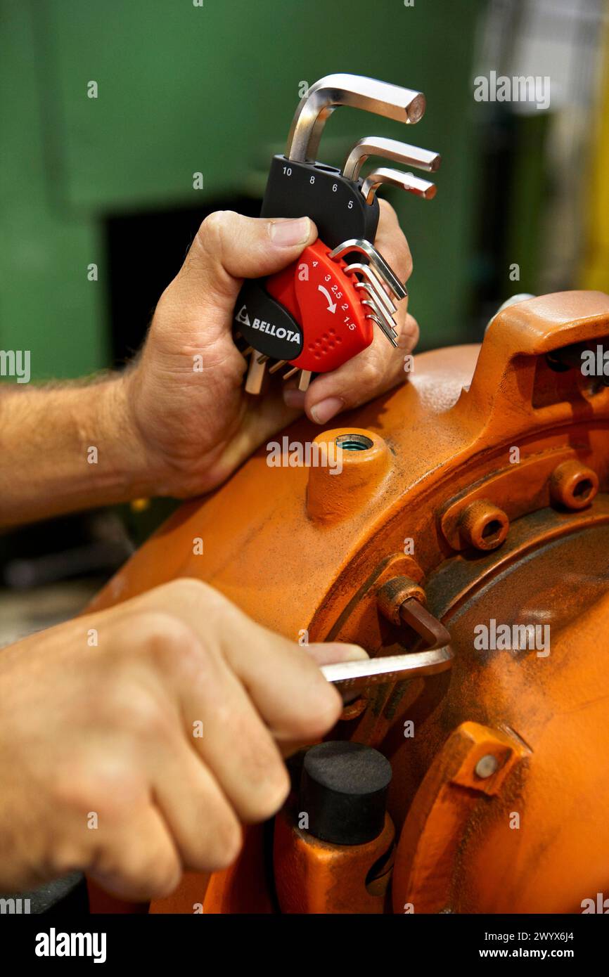Worker using Allen keys, industrial maintenance Stock Photo - Alamy