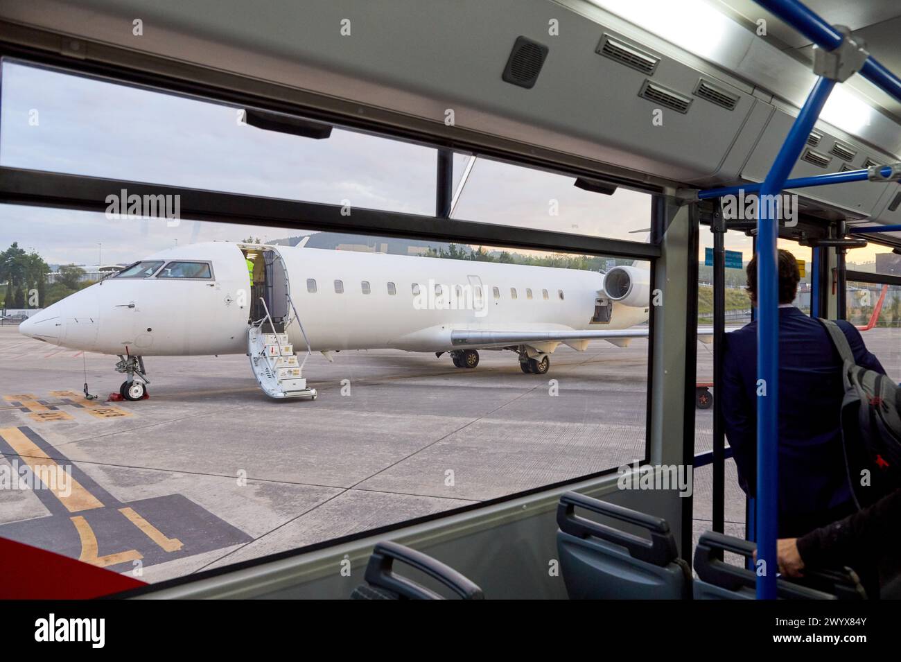 Passengers leaving the bus on the way to the plane, Bilbao Airport ...