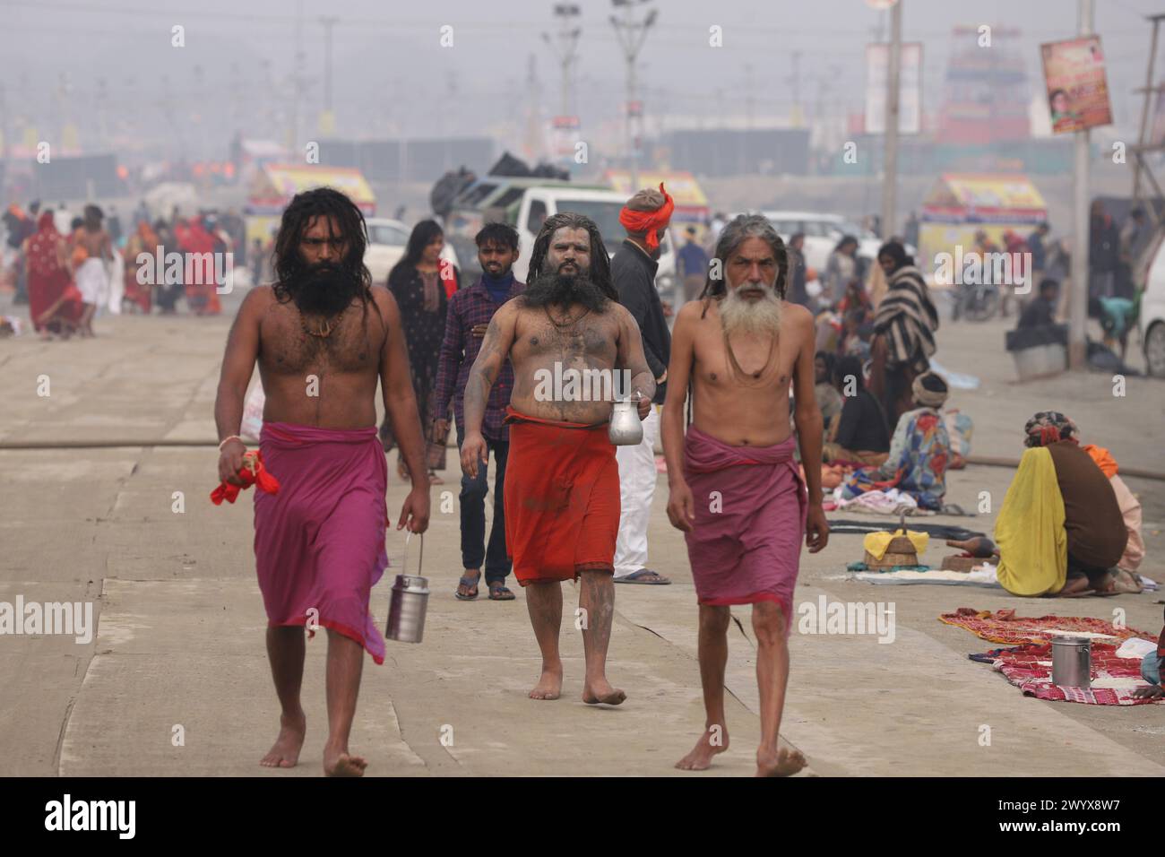 Sadhus walks towards to their religious camp after taking holy bath in ...