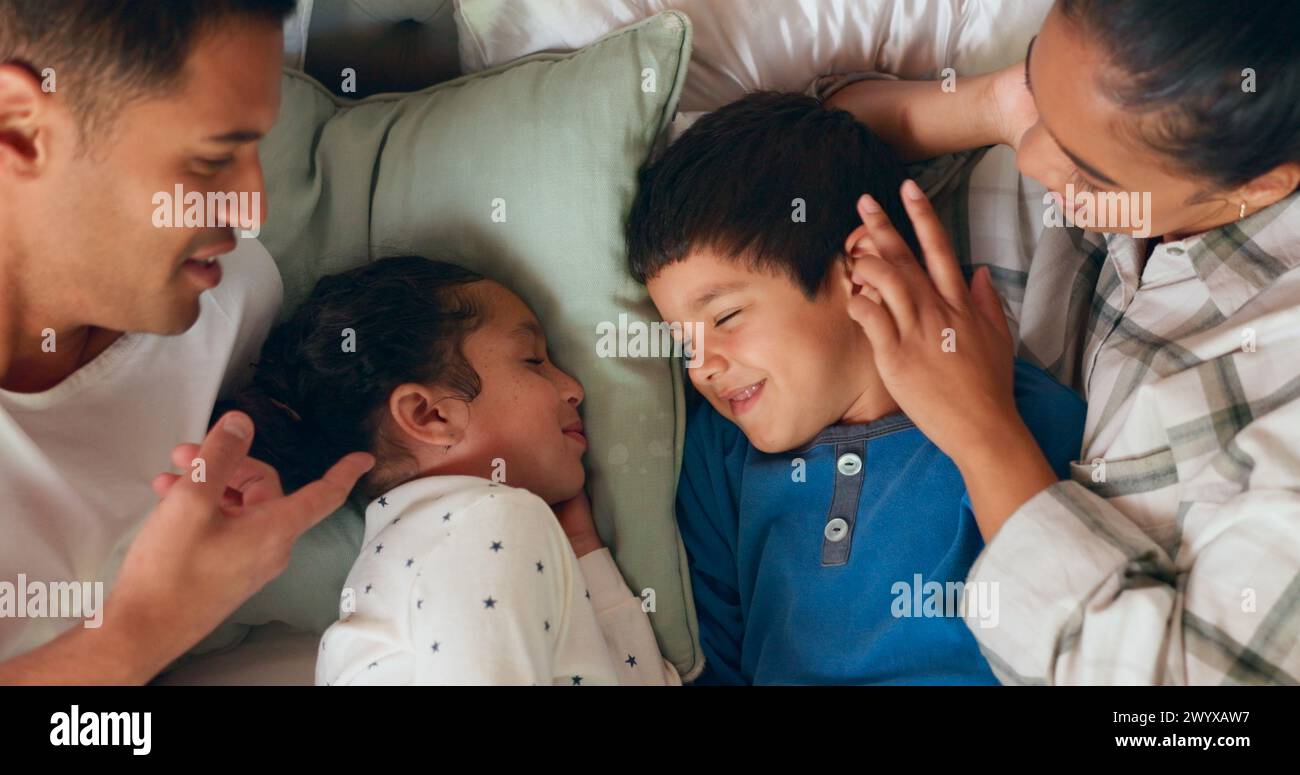 Love, bonding and kids sleeping by their parents in the bed for ...