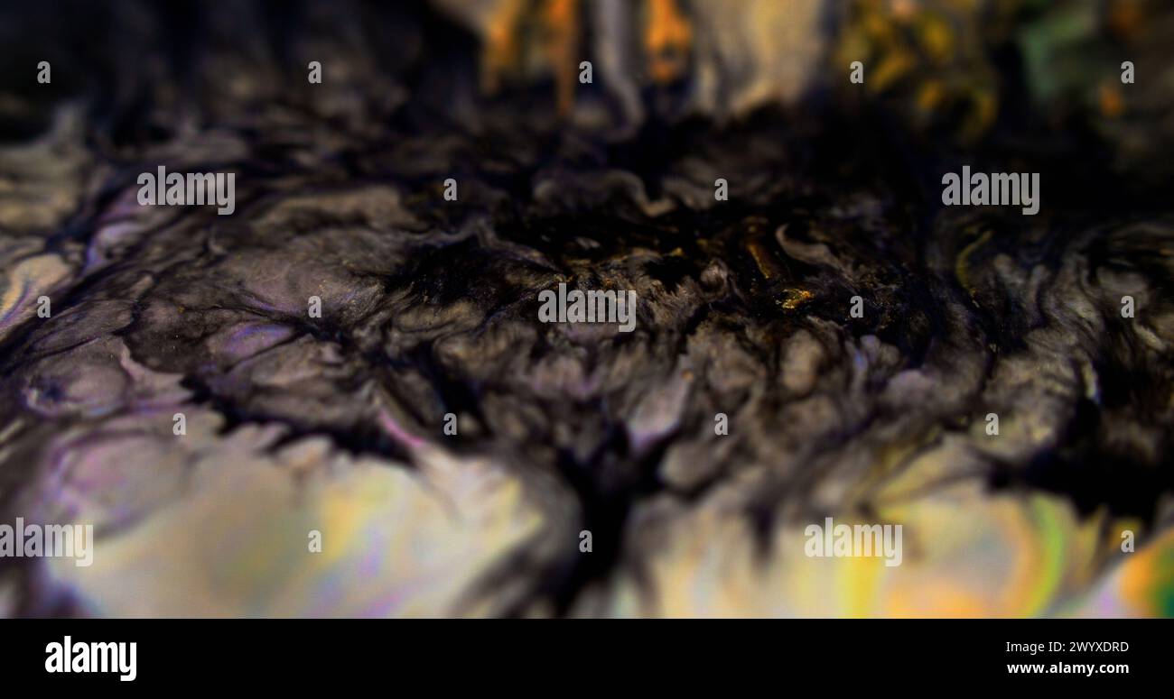 Ink liquid mix. Sparkling paint. Defocused black white golden color ...