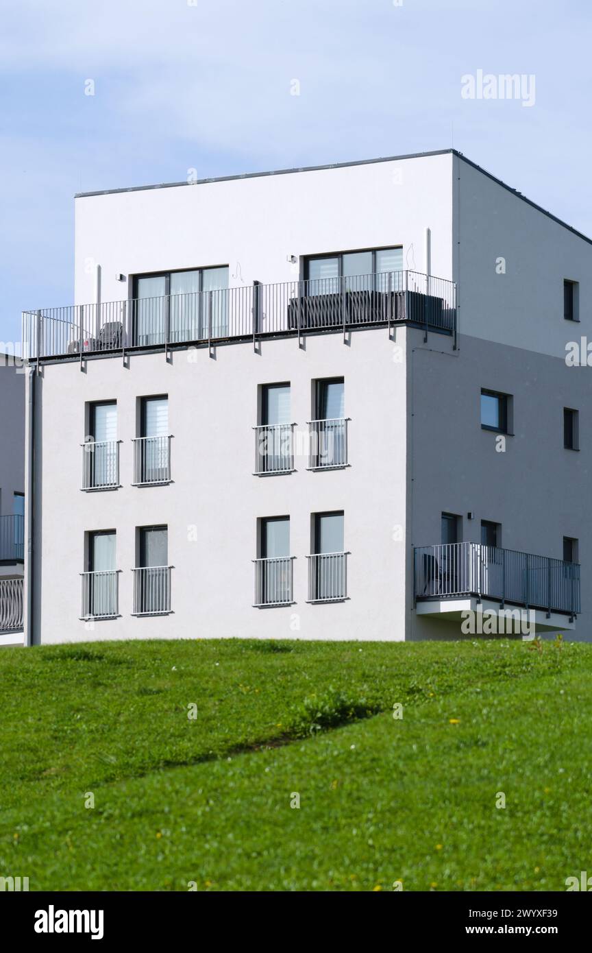 Newly built block of flats in nature. Modern, ecological, generic ...