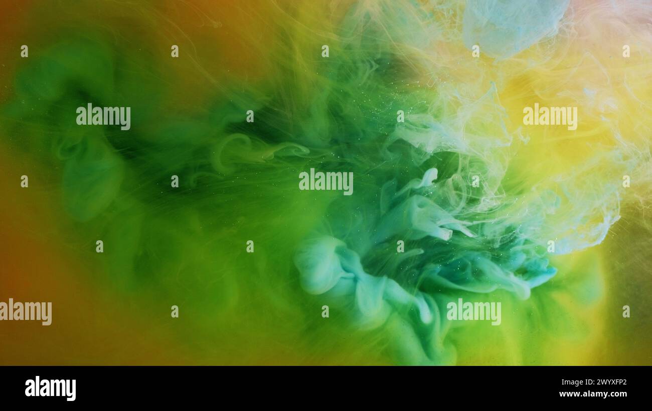 Color splash. Ink water explosion. Fantasy smoke. Bright green yellow blue orange fluid haze ...