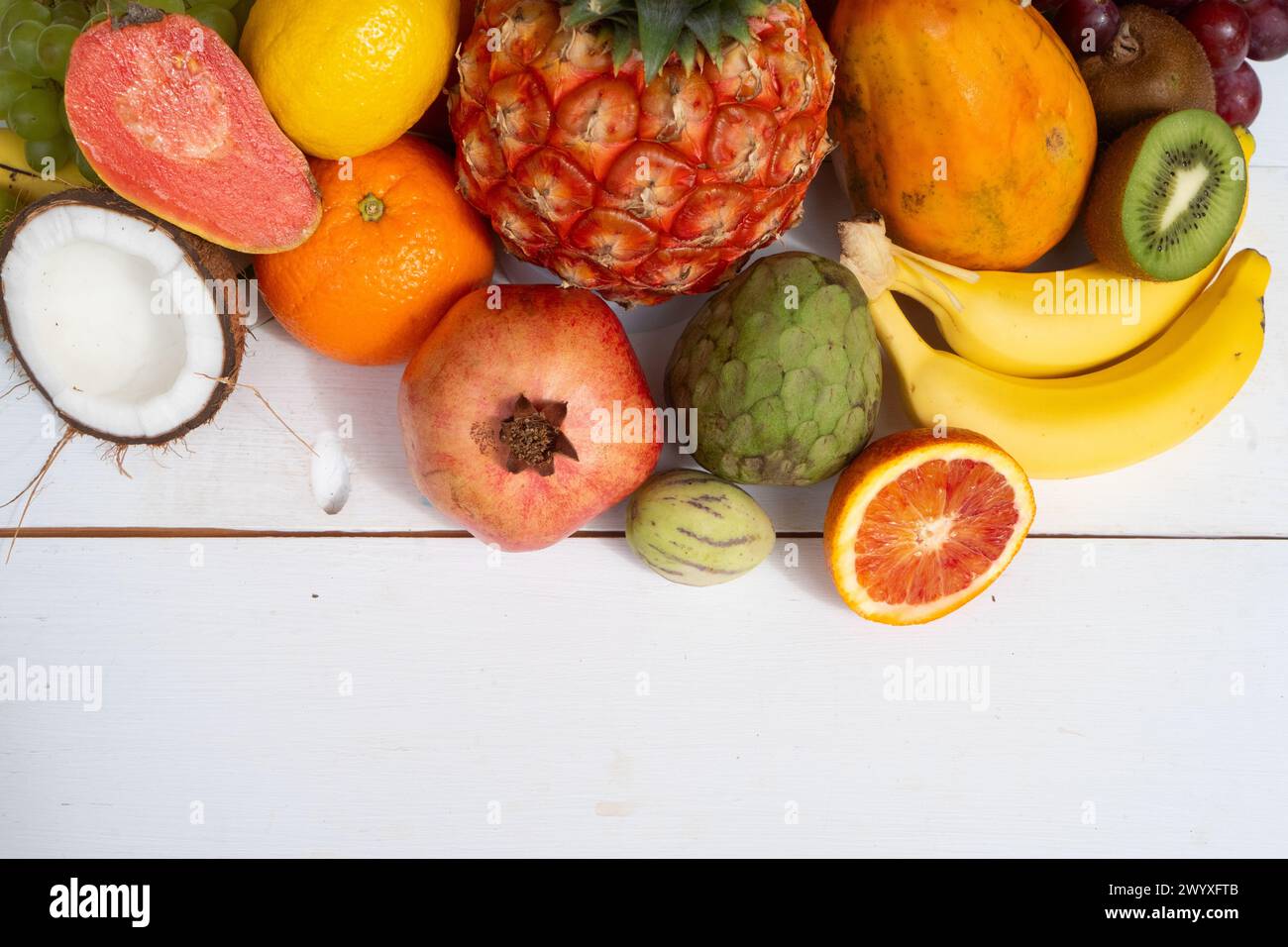 Summer mix of tropical fruits over white Stock Photo - Alamy