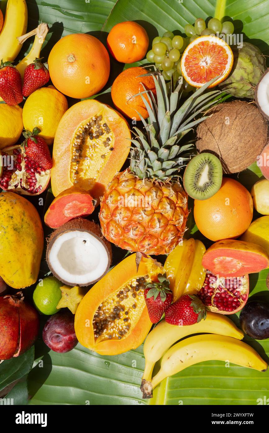 Summer mix of tropical fruits over white Stock Photo - Alamy
