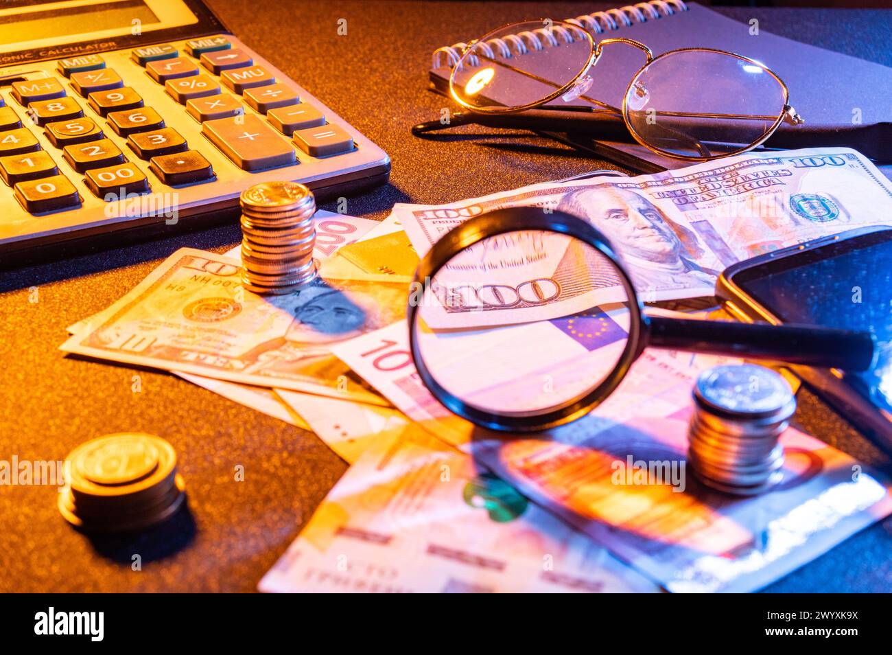 Money is scattered on the table. Banknotes and coins on the table. View ...