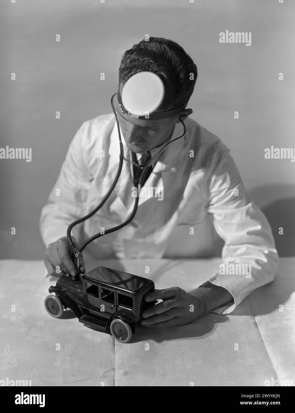 Gordon Burt - A man is humorously depicted as using a stethoscope on a ...