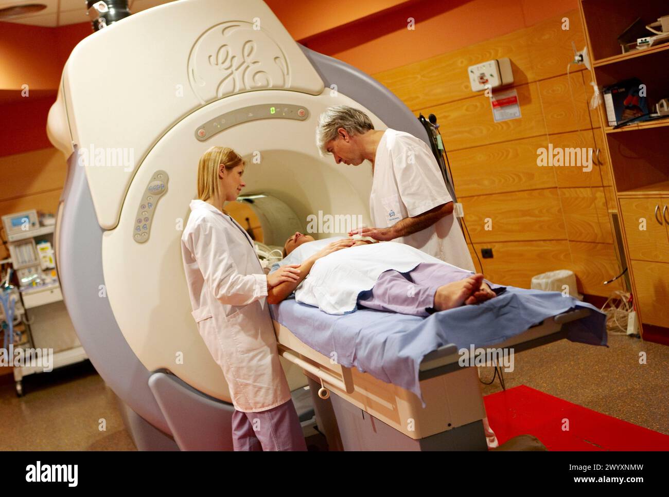 Nurses and patient, MRI, medical imaging for diagnosis, Hospital ...